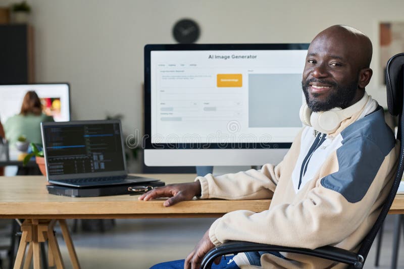 Two Young Successful Technicians in Gloves and Uniform Working by Desk ...