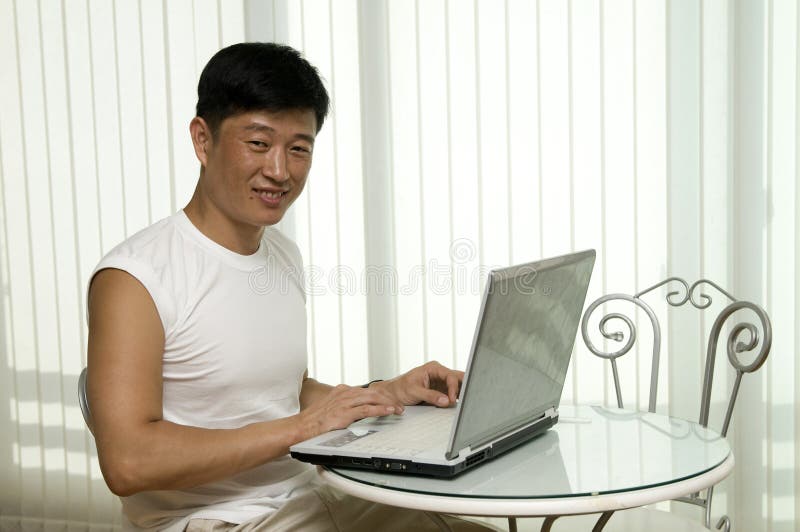 The Young Successful Man with the Computer Stock Image - Image of floor ...