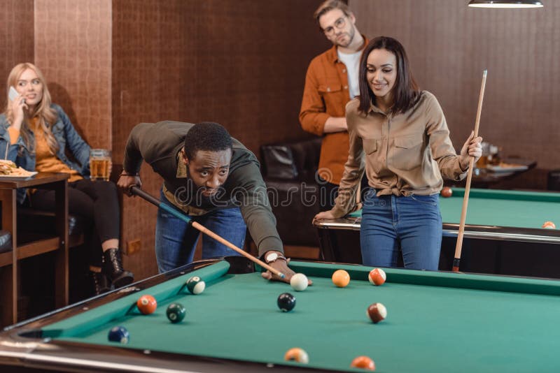 Young Successful Multiethnic Friends Playing in Pool Stock Photo ...