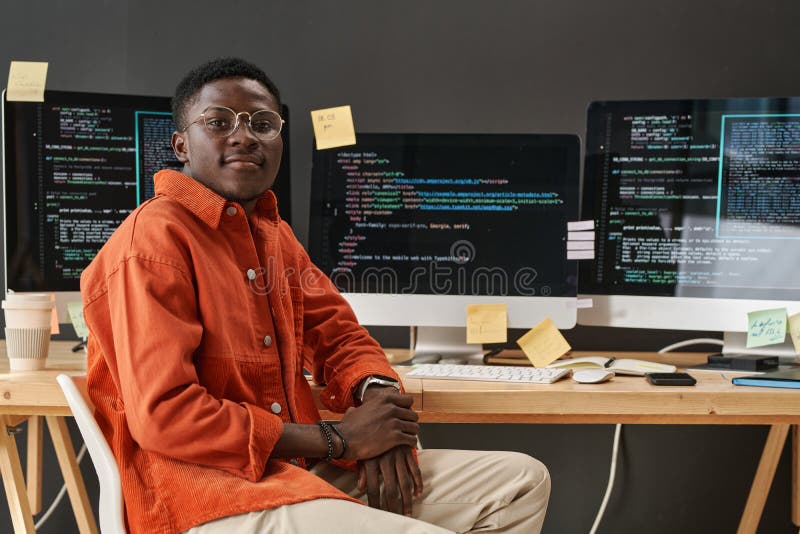 Young African American it Engineer or Webdesigner Looking at Laptop ...