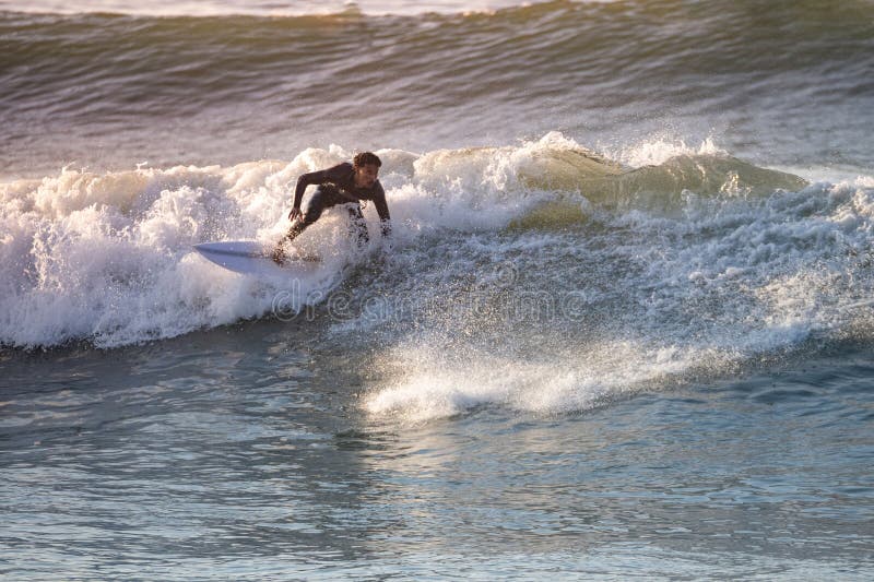 Young Surfer Enjoying Waves Stock Image - Image of ride, ocean: 304466597