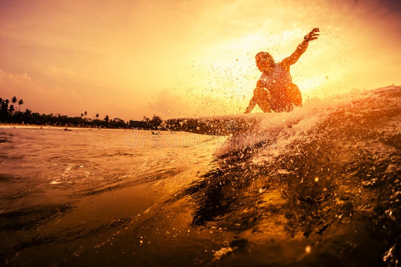 Young Surfer Dives Under the Ocean Wave Stock Image - Image of active ...