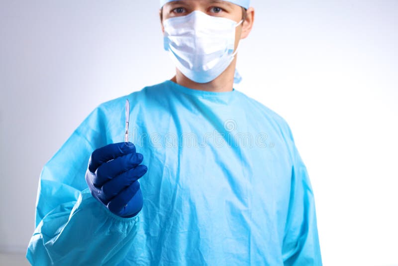 Young Surgeon Holding a Scalpel. Ready for Operation Stock Photo ...