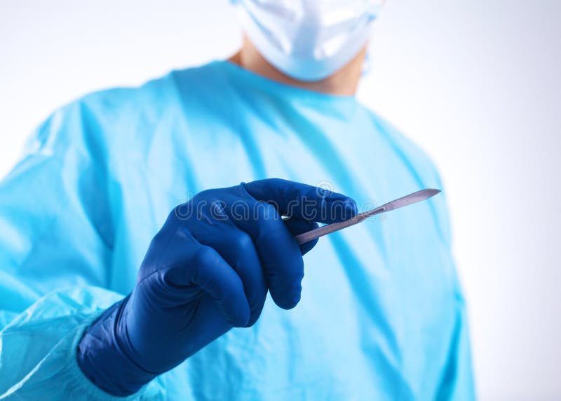 Young Surgeon Holding a Scalpel. Ready for Operation Stock Photo ...