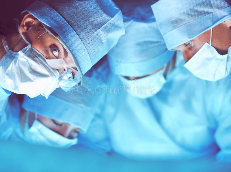 Young Surgery Team in the Operating Room Stock Image - Image of ...