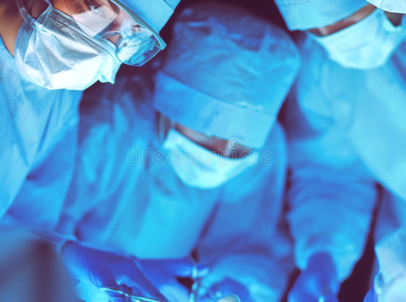 Young Surgery Team in the Operating Room Stock Image - Image of glove ...
