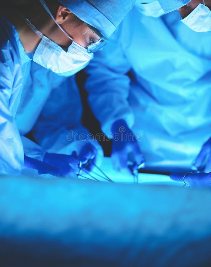 Young Surgery Team in the Operating Room Stock Image - Image of surgeon ...