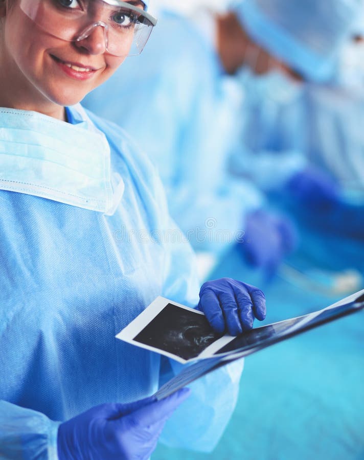 Young Surgery Team in the Operating Room Stock Image - Image of scrub ...