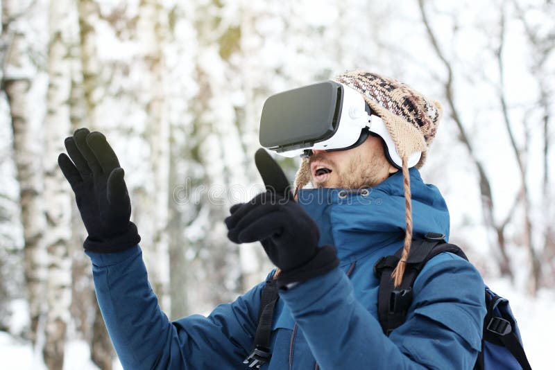 Young Surprised Bearded Man in Knitted Hat, Warm Jacket and Gloves ...