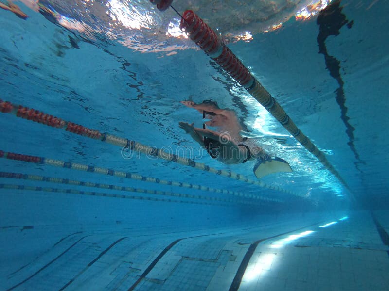 Young Swimmer Training Inside the Swimming Pool Stock Image - Image of ...