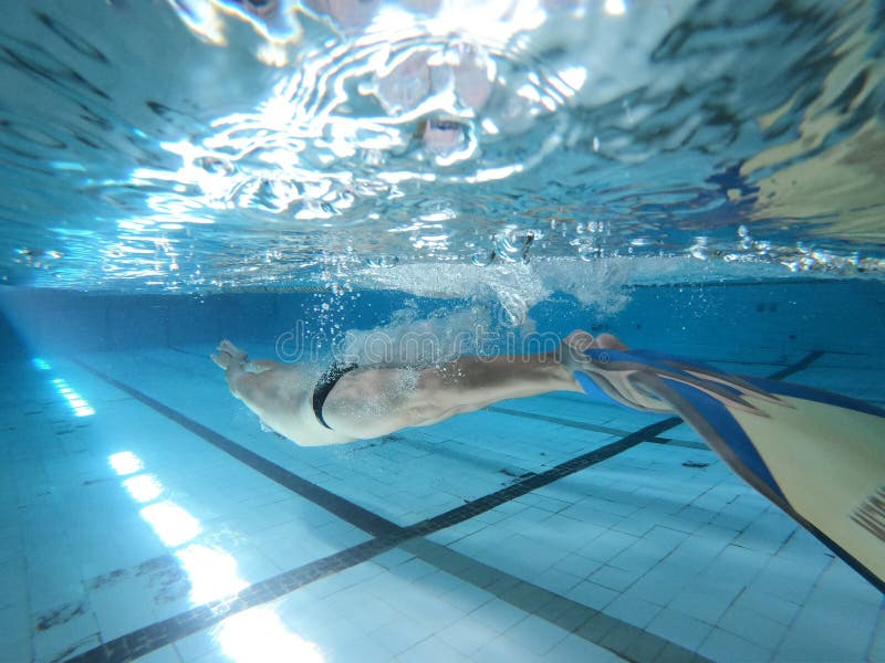 Young Swimmer Training Inside the Swimming Pool Stock Photo - Image of ...