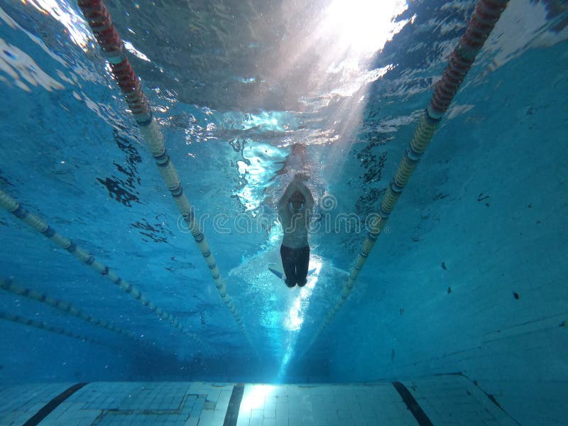 Young Swimmer Training Inside the Swimming Pool Stock Image - Image of ...