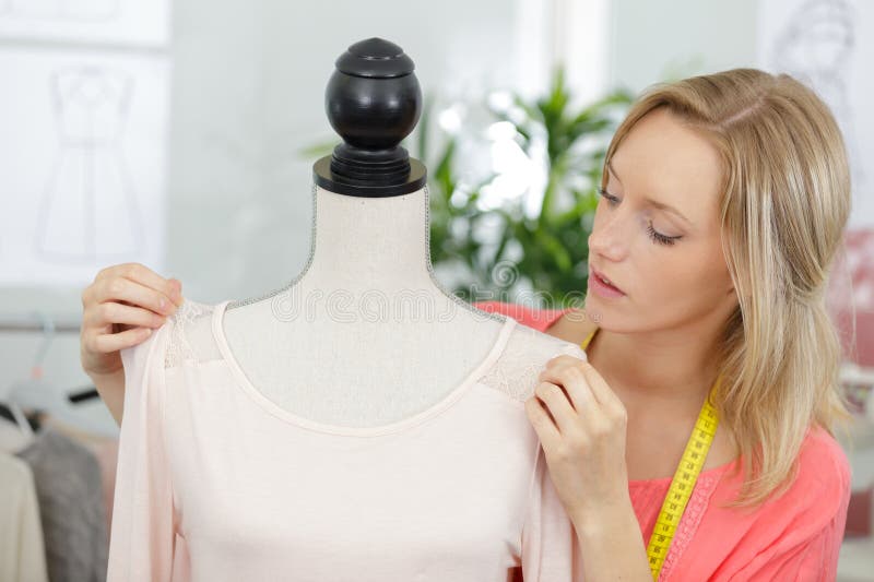 Young Tailor Adjusting Dress on Mannequin Stock Image - Image of design ...