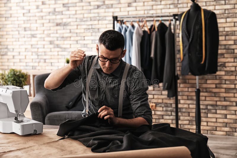 Young Tailor Sewing at Table in Atelier Stock Image - Image of industry ...