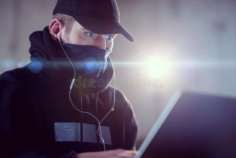 Young Talented Hacker Using Laptop Computer while Working in Dark ...