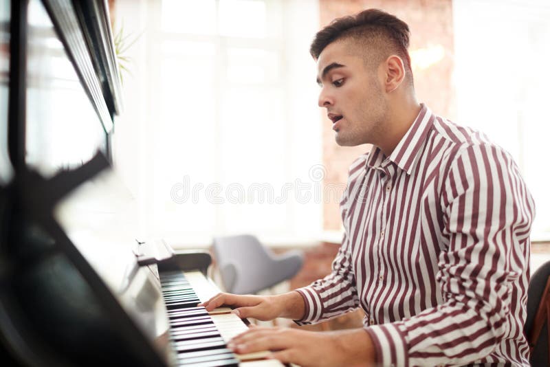 Talented guy stock image. Image of piano, singing, handsome - 107730441