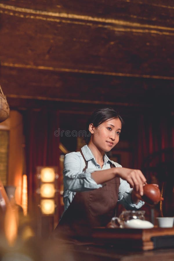 Young Tea Master Pouring Tea Stock Image - Image of culture, wooden ...