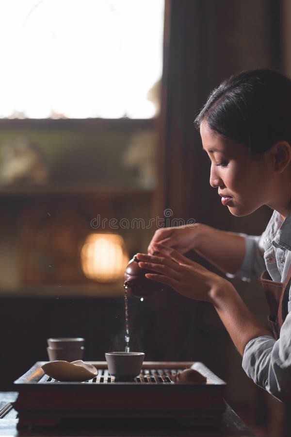 Young girl pouring tea stock image. Image of girl, asia - 116881579