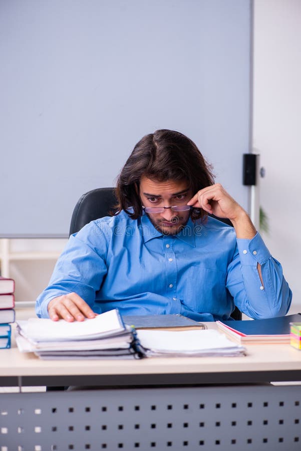 Young Male Teacher in the Classroom Stock Image - Image of graduation ...