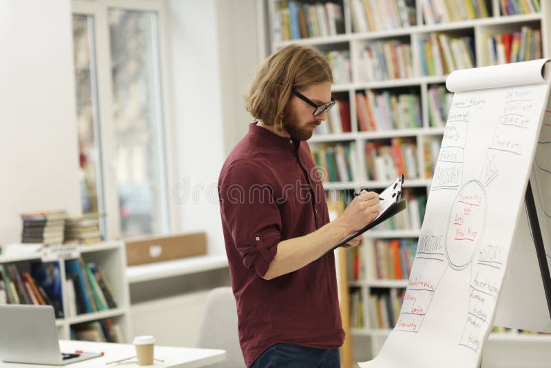 Young Teacher Preparing for the Lecture Stock Photo - Image of ...