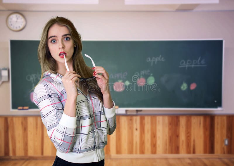 Young Teacher in Front of a Blackboard Stock Image - Image of pointing ...