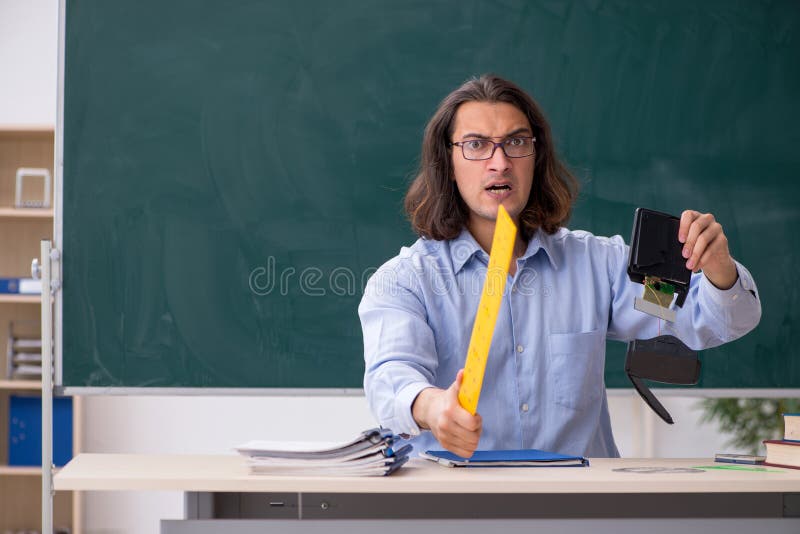 Young Male Teacher in Front of Green Board Stock Photo - Image of board ...