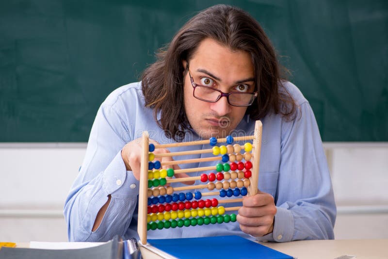 Young Male Teacher in Front of Green Board Stock Photo - Image of class ...