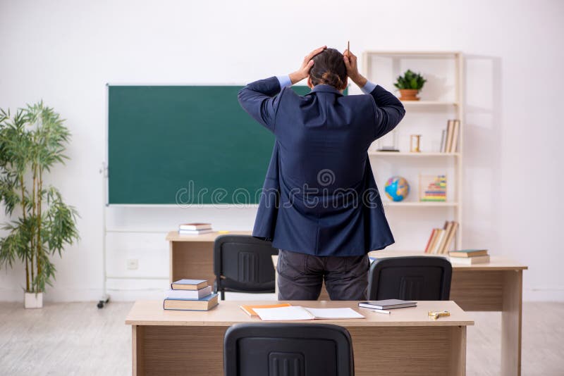 Young Male Teacher in Front of Green Board Stock Image - Image of exam ...