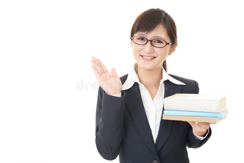 A Young Teacher Holding Books Stock Photo - Image of communication ...