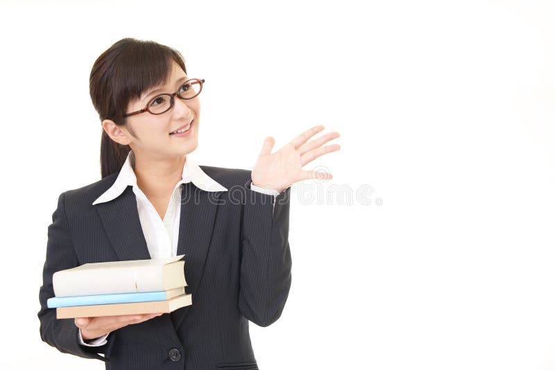 A Young Teacher Holding Books Stock Image - Image of face, hand: 109469249