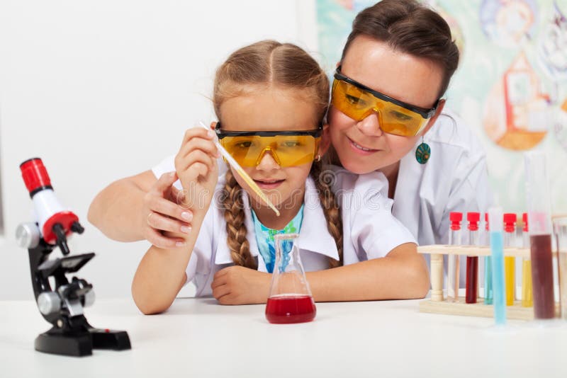 Young Teacher with Little Student at Elementary Science Class Stock ...