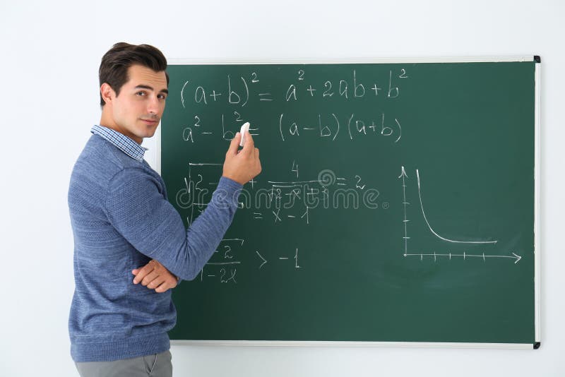 Young Teacher Near with Math Formulas in Classroom Stock Image - Image ...