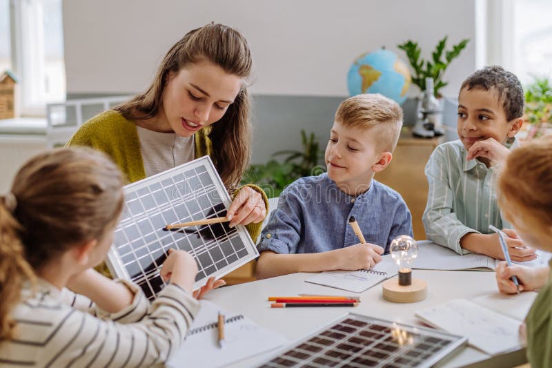 Young Teacher with Solar Panel Learning Pupils about Solar Energy ...