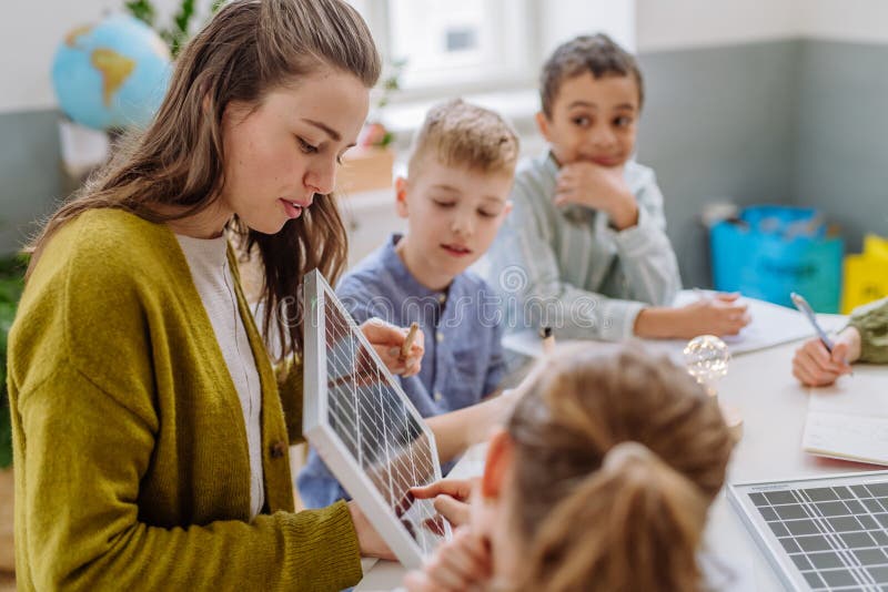 Young Teacher with Solar Panel Learning Pupils about Solar Energy ...