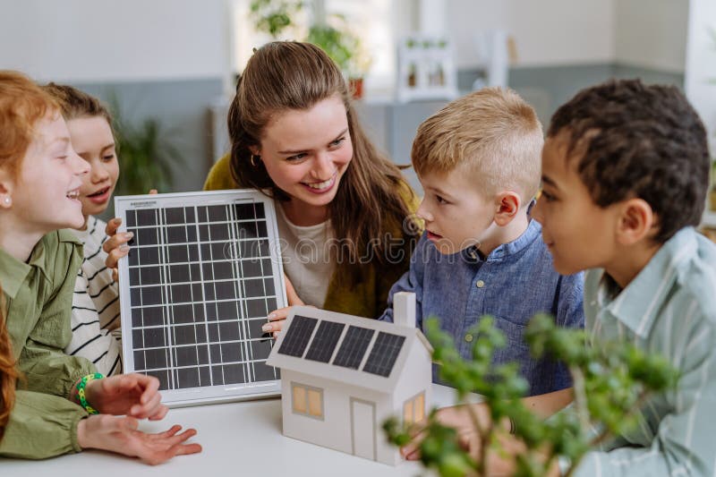 Young Teacher with Solar Panel Learning Pupils about Solar Energy ...