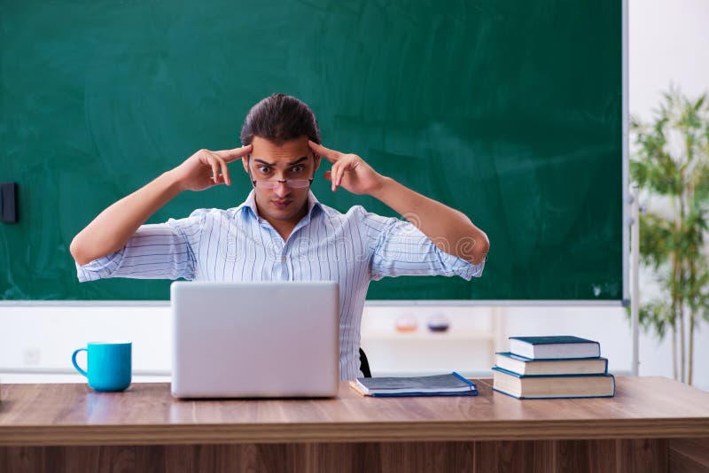 Young Male Teacher in Tele-education Concept in the Classroom Stock ...