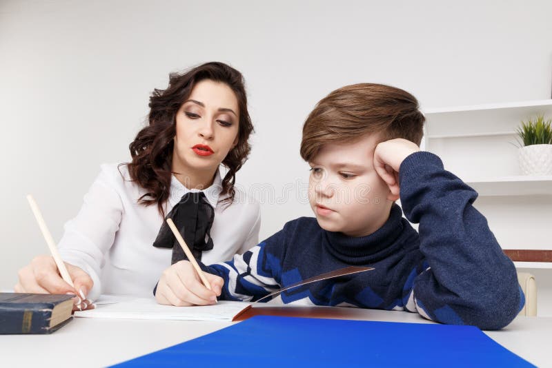 Young Teacher Trying To Explain Information To the Boy. Educating ...