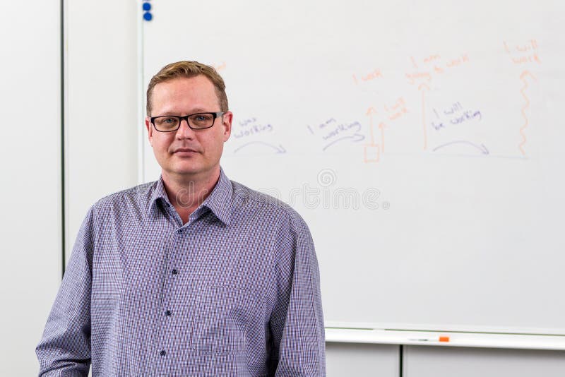 Young Teacher Writing English Grammar on the Board. Study English ...