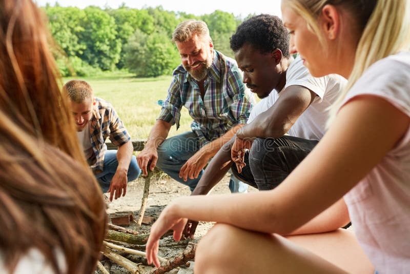 Young Team is Sitting by the Campfire in Nature Stock Image - Image of ...
