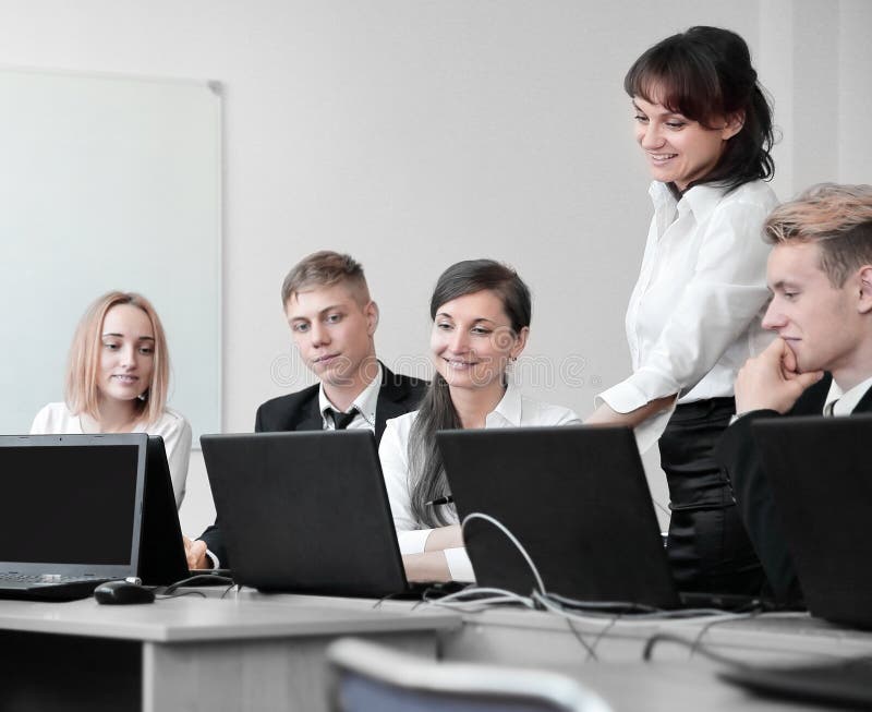 Young Team Using Laptops during an Informal Meeting. Stock Photo ...
