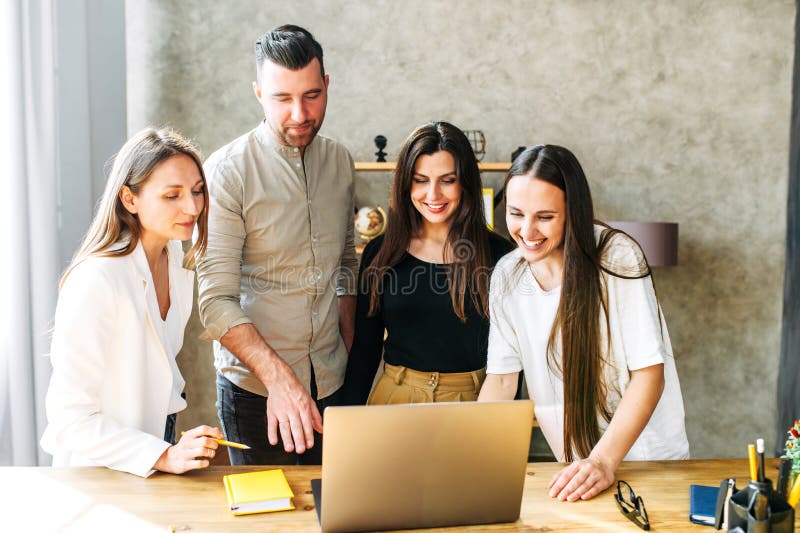 Young Team Works on Laptop at the Office Desk Stock Photo - Image of ...