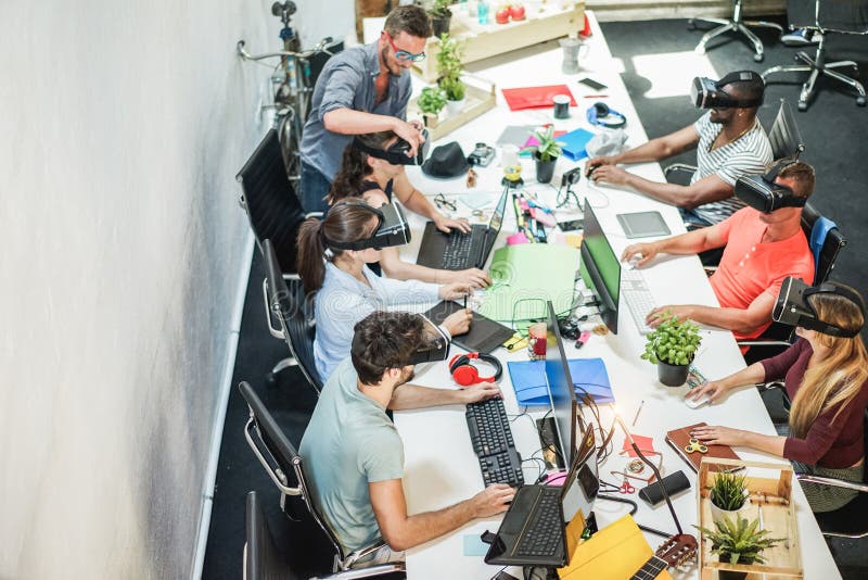 Young Teamwork Using Virtual Reality Glasses in Creative Office - Co ...