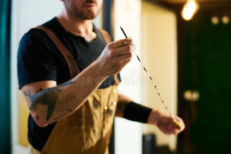 Young Technician in Apron Holding Sharp Metallic Wire while Preparing ...