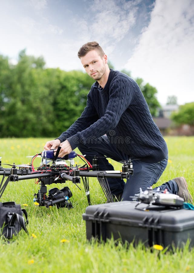 Young Technician Assembling UAV in Park Stock Photo - Image of aviation ...
