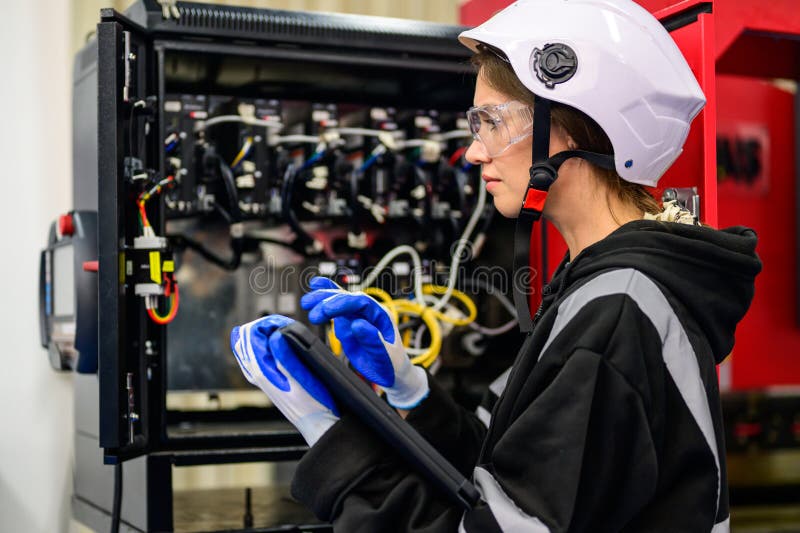 Young Technician Checking and Repairing Part of Automatic Machine Stock ...
