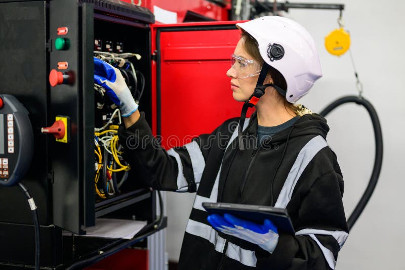Young Technician Checking and Repairing Part of Automatic Machine Stock ...
