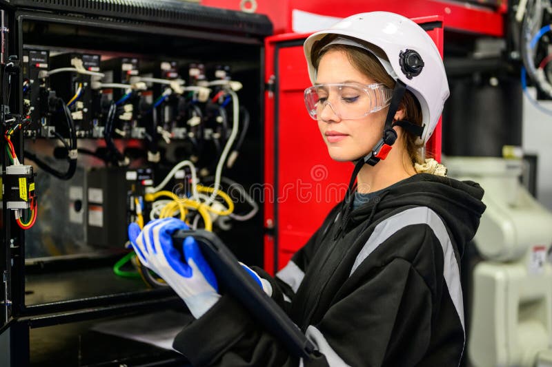 Young Technician Checking and Repairing Part of Automatic Machine Stock ...