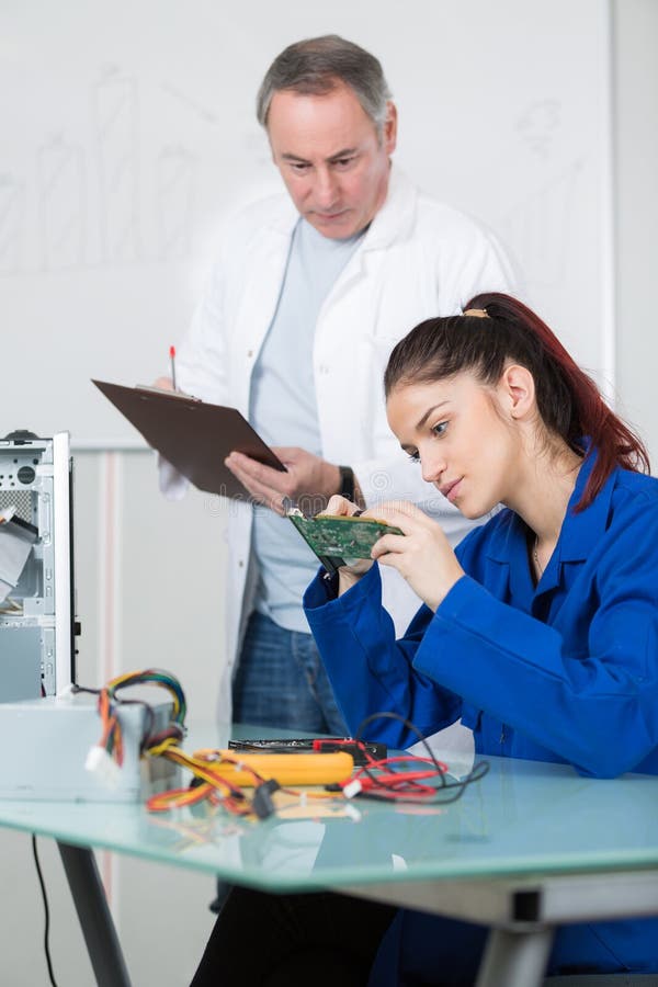 Young Technician Checks Electronic Device Stock Photos - Free & Royalty ...