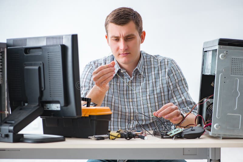 The Young Technician Repairing Computer in Workshop Stock Image - Image ...