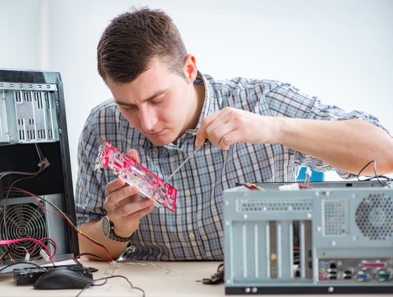 Young Technician Repairing Computer in Workshop Stock Image - Image of ...